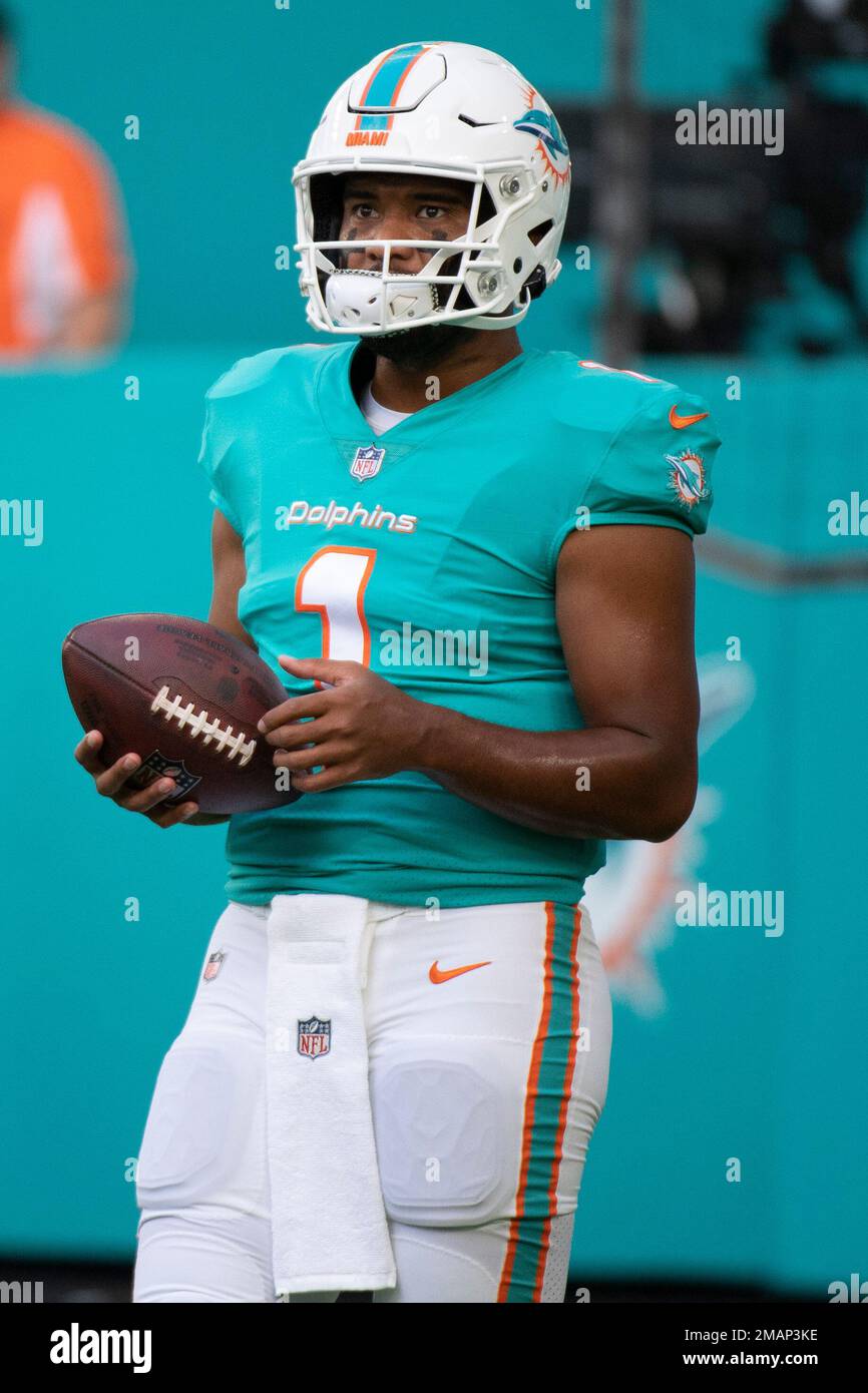 Miami Dolphins quarterback Tua Tagovailoa (1) holds the football as he ...