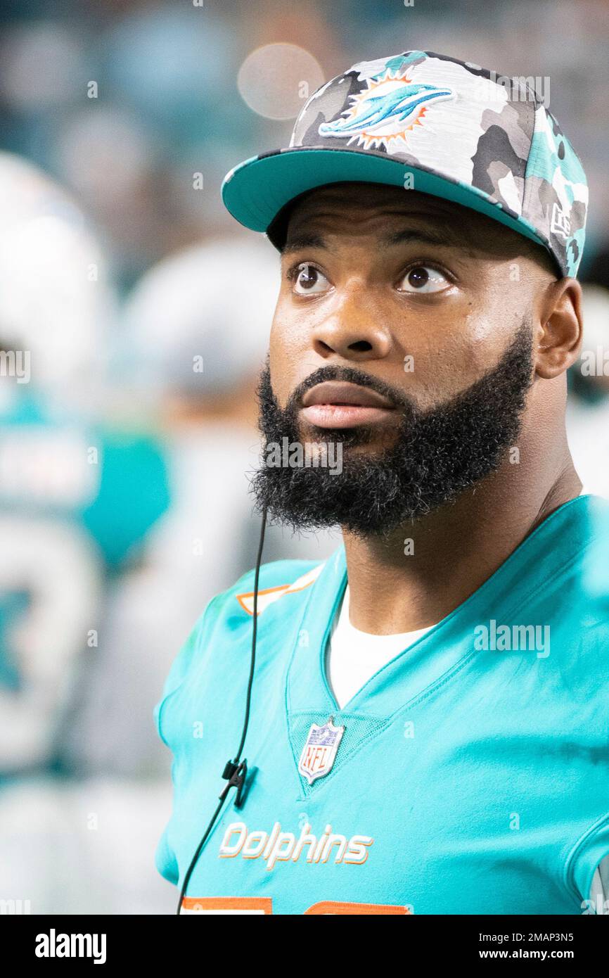 Miami Dolphins linebacker Elandon Roberts (52) stands on the sidelines ...