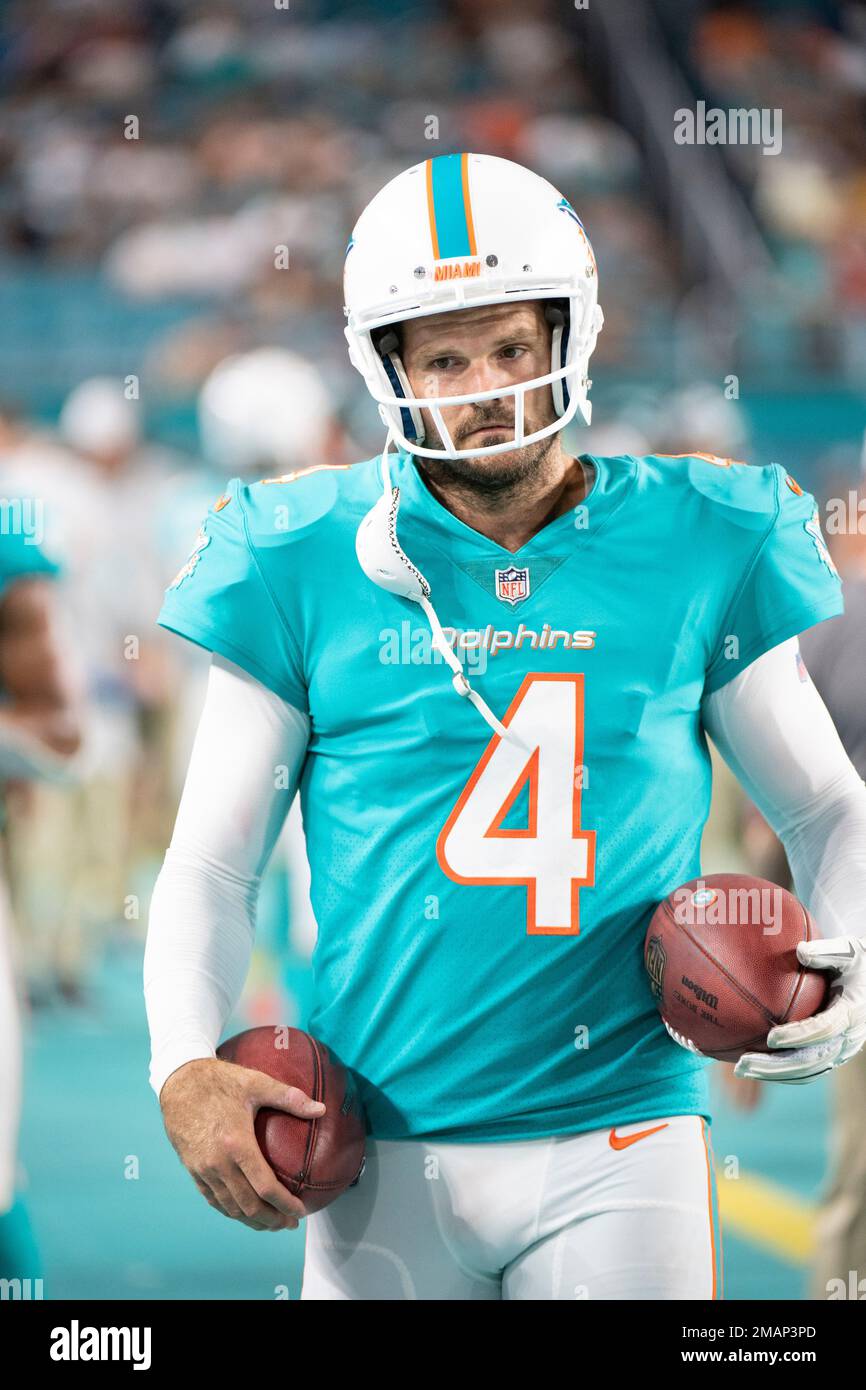 Miami Dolphins punter Thomas Morstead (4) holds footballs on the ...