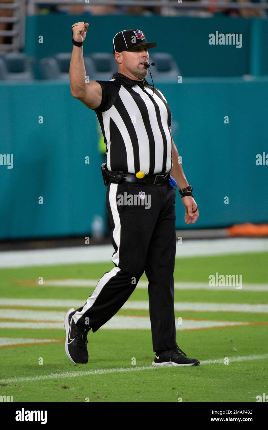NFL umpire Tab Slaughter gestures on the field during an NFL football ...