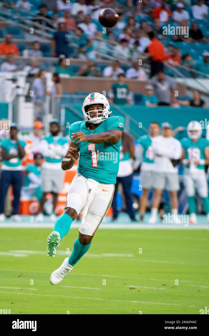 Miami Dolphins quarterback Tua Tagovailoa (1) throws the ball during an ...