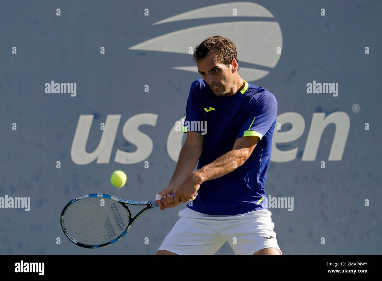 Albert Ramos-Vinolas, of Spain, returns a shot to Norbert Gombos, of ...