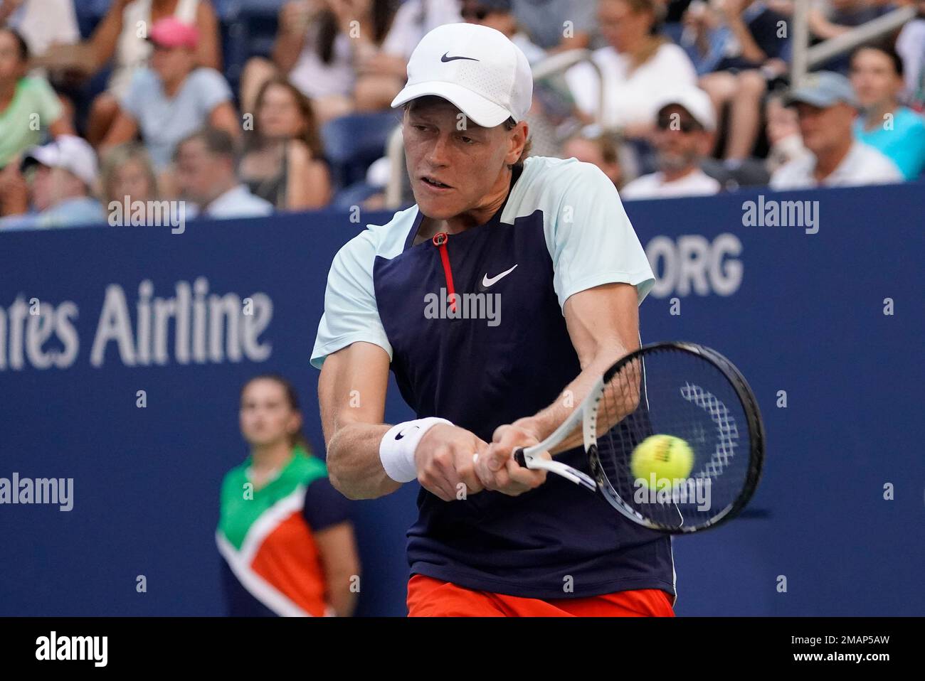 Jannik Sinner, of Italy, returns a shot to Daniel Altmaier, of Germany ...
