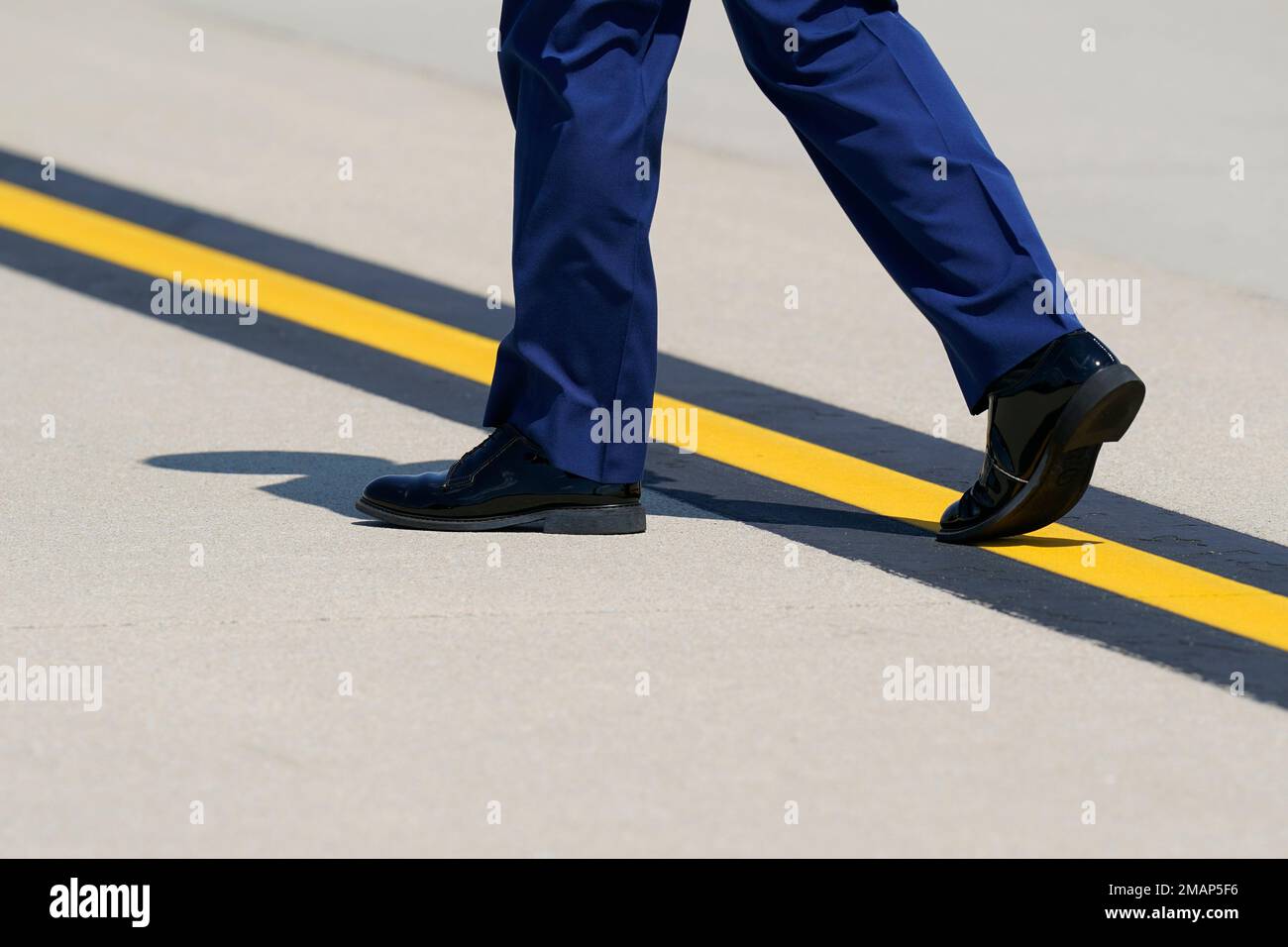 Col. Matthew Jones, Commander, 89th Airlift Wing, walks on the tarmac ...
