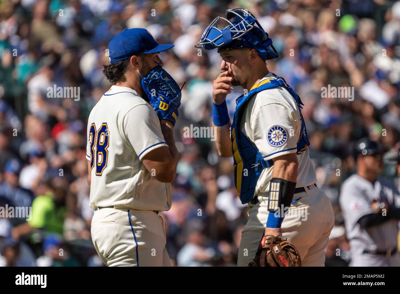 Seattle Mariners starting pitcher Robbie Ray, left, and catcher Cal ...