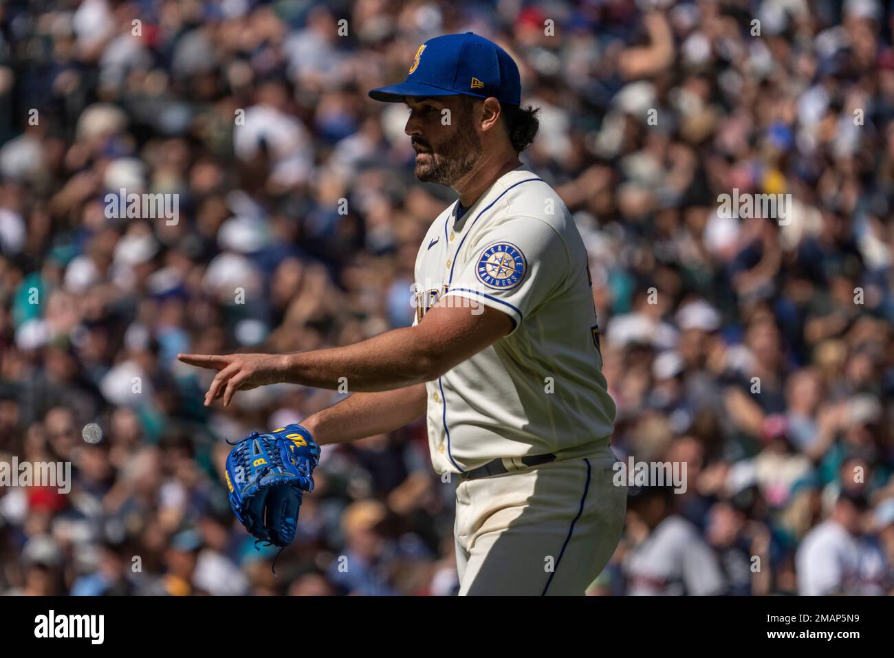 Seattle Mariners starting pitcher Robbie Ray gestures as he walks off ...