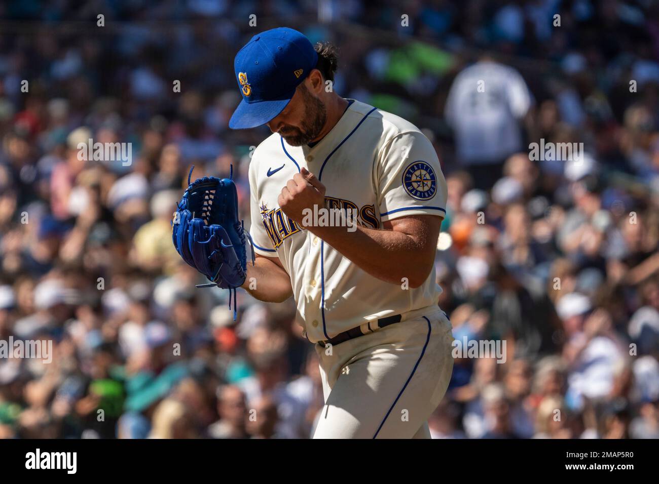 Seattle Mariners starting pitcher Robbie Ray pounds his glove as he ...