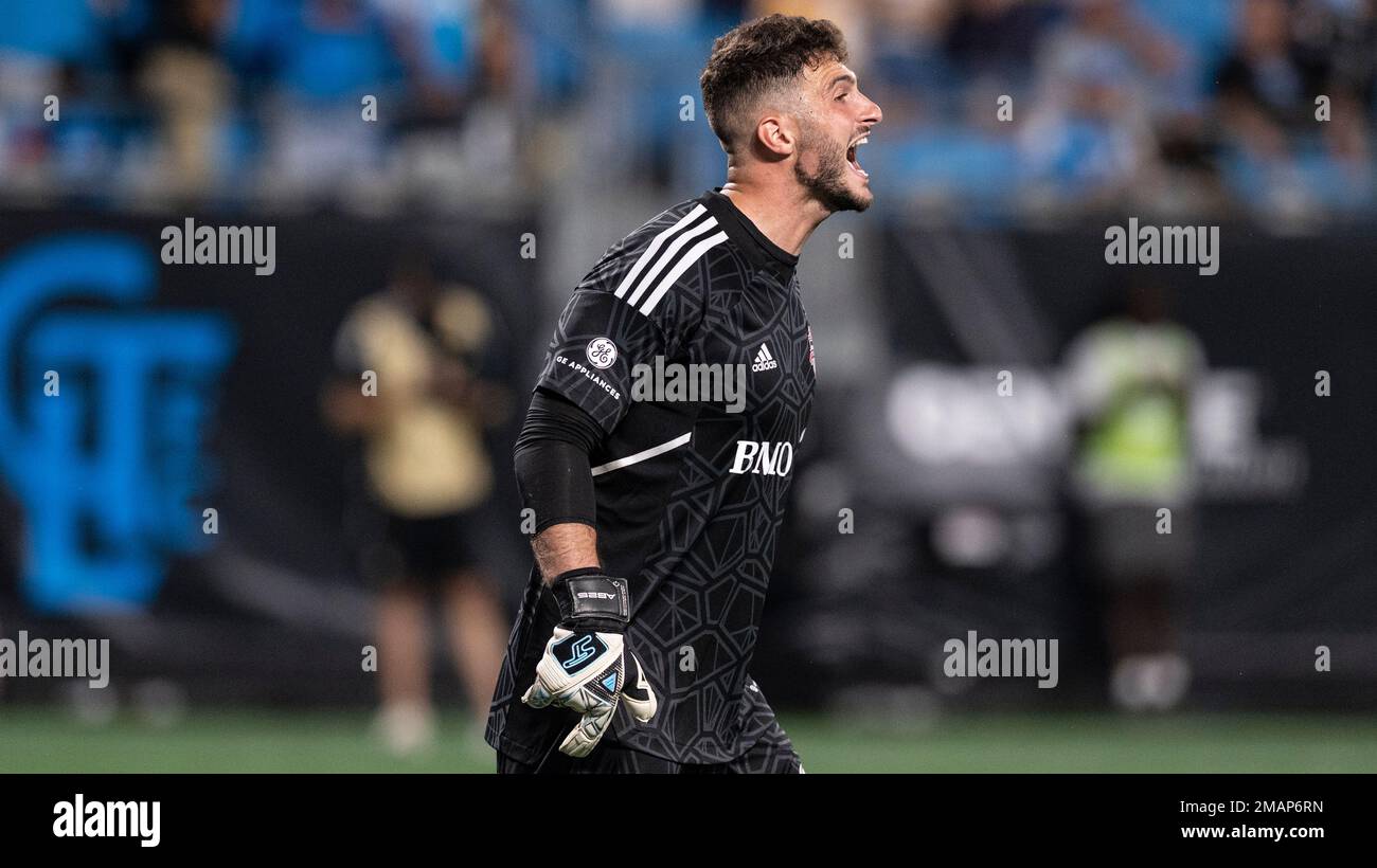 Toronto FC goalkeeper Alex Bono, center, reacts to winning an MLS ...