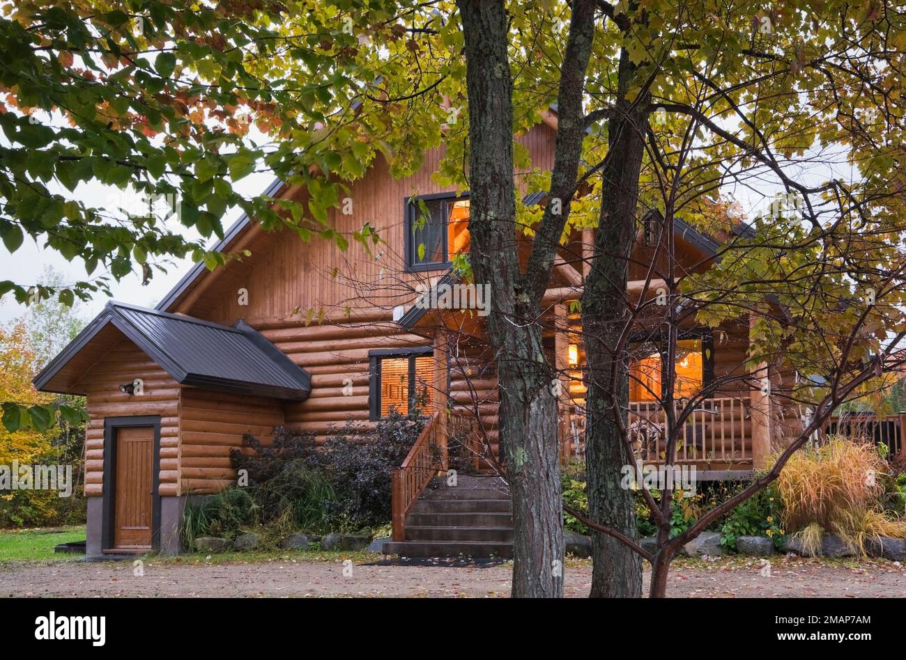 Scandinavian cottage style log home exterior in autumn Stock Photo - Alamy
