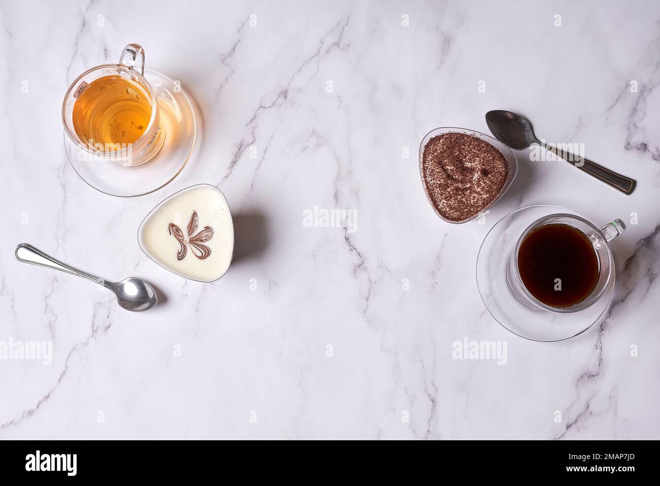 some teas and spoons on a white marble countertopped image is in the ...