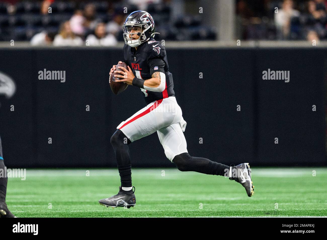 Atlanta Falcons quarterback Desmond Ridder (4) works during the first ...
