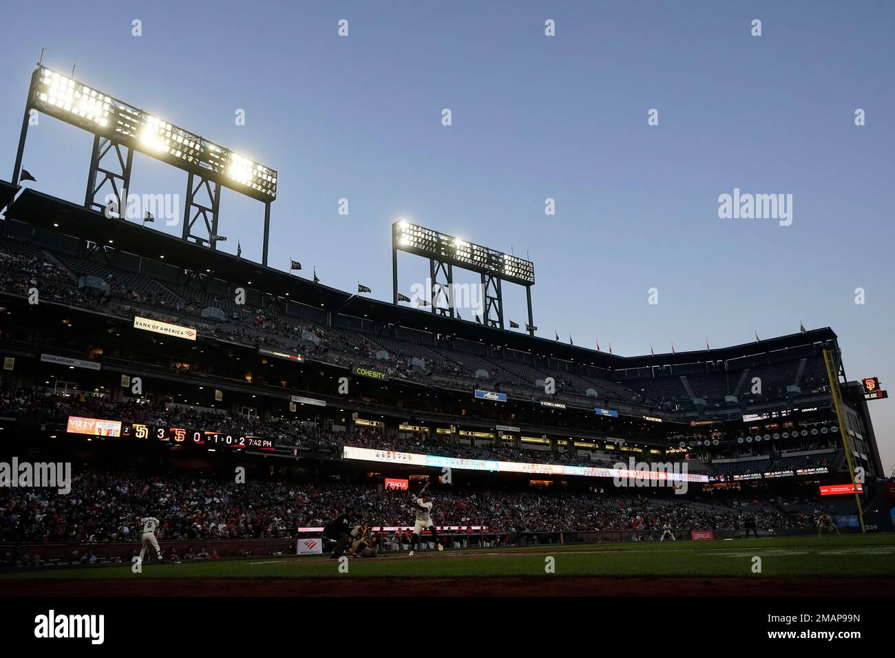 San Francisco Giants' Thairo Estrada, bottom center, bats against the ...