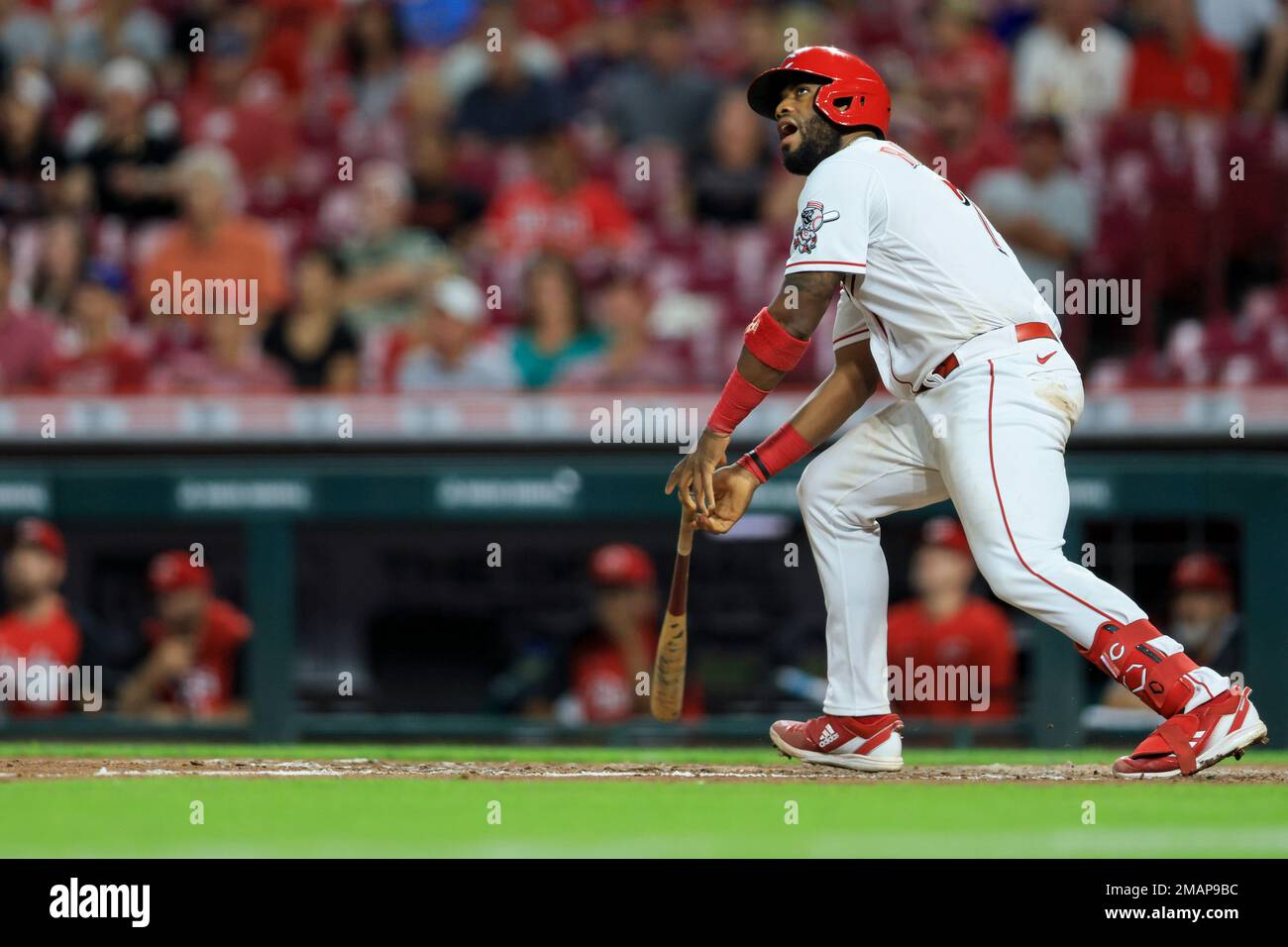 Cincinnati Reds' Chuckie Robinson watches his two-run home run during ...