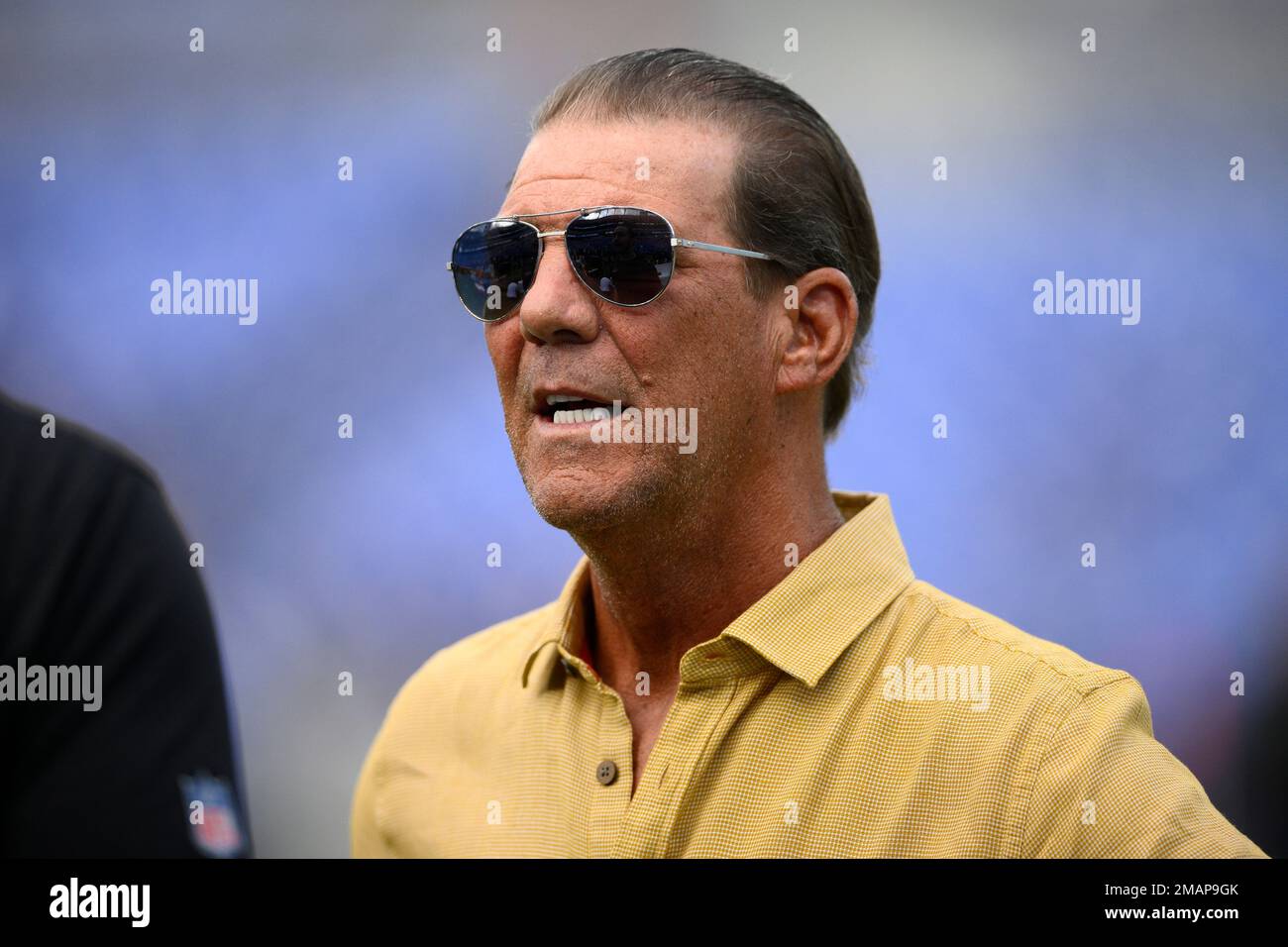 Baltimore Ravens owner Steve Bisciotti walks on the field before a ...
