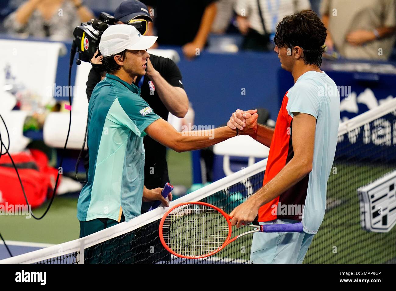 Brandon Holt, left, of the United States, shakes hands with Taylor ...