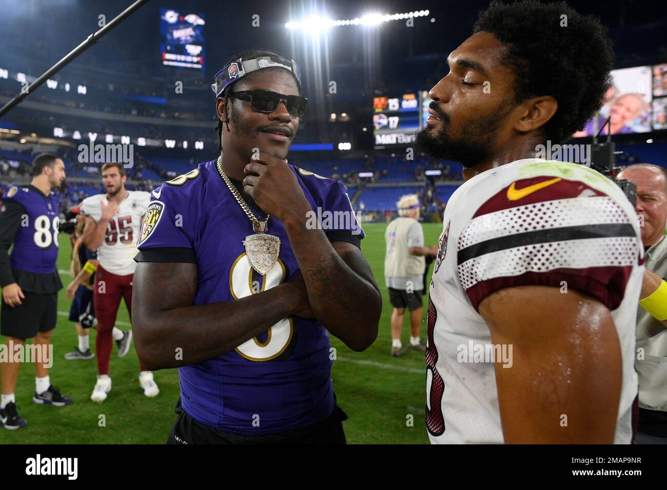 Baltimore Ravens quarterback Lamar Jackson (8) talks with Washington ...
