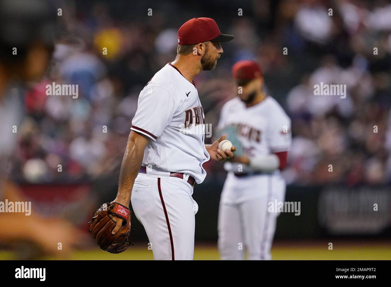 Arizona Diamondbacks starting pitcher Madison Bumgarner looks away ...