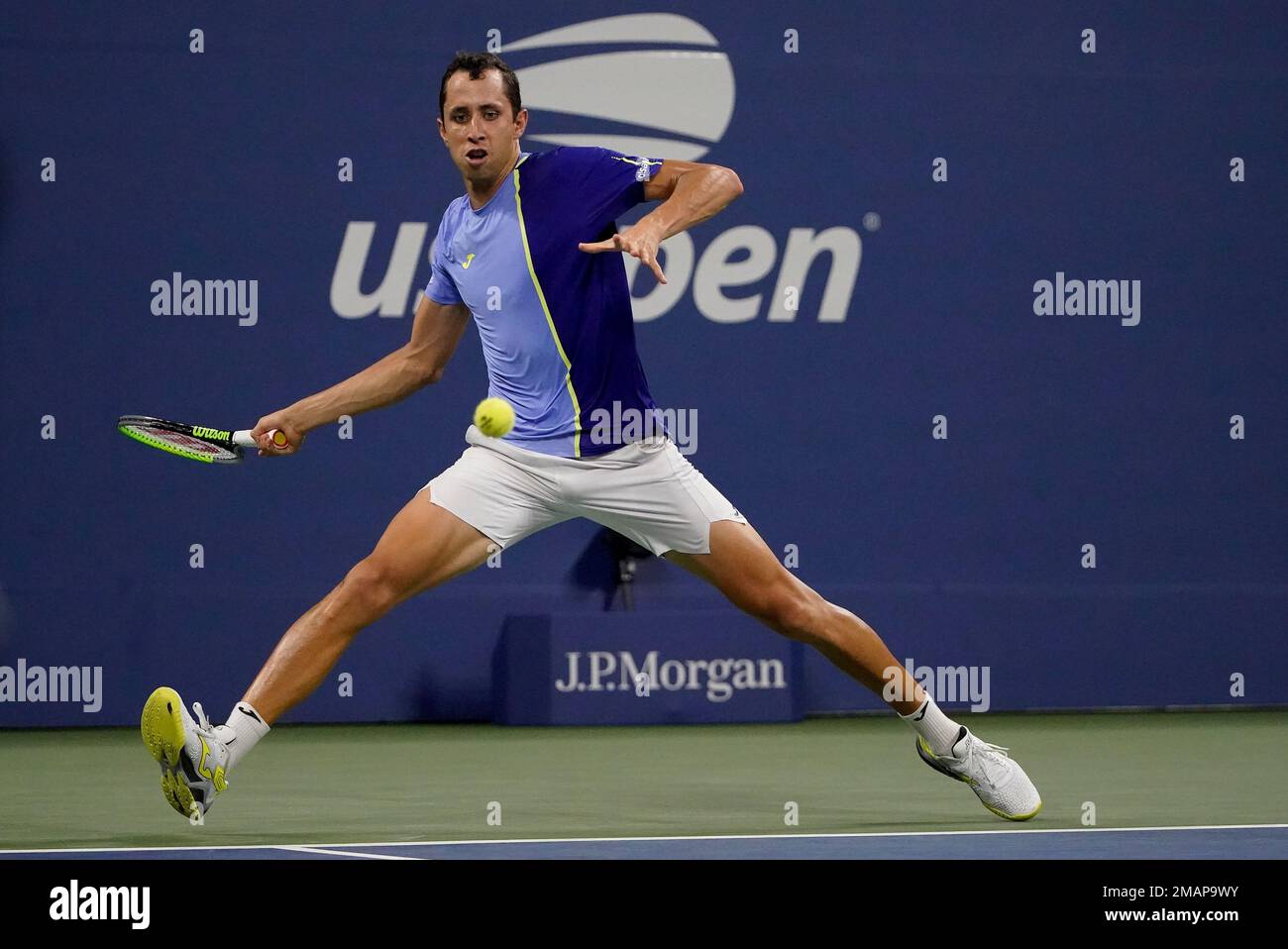 Daniel Elahi Galan, of Colombia, returns a shot to Stefanos Tsitsipas, of Greece, during the ...