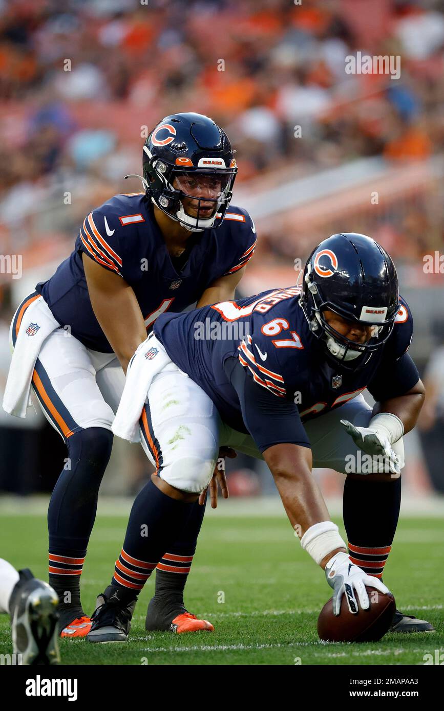 Chicago Bears quarterback Justin Fields (1) lines up for a play behind ...