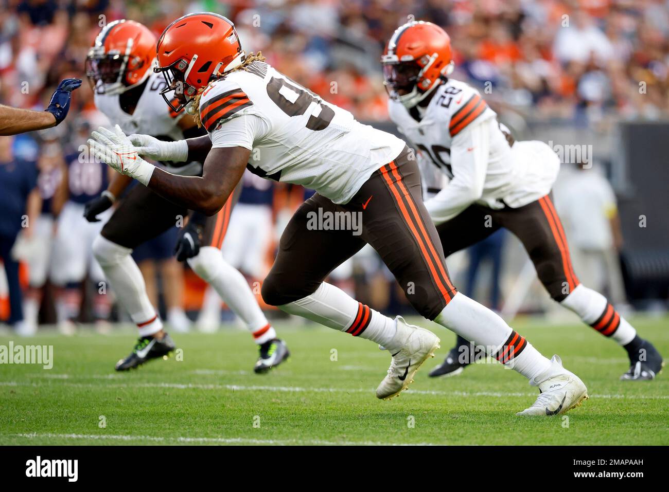 Cleveland Browns defensive end Alex Wright (94) runs off of the line of ...
