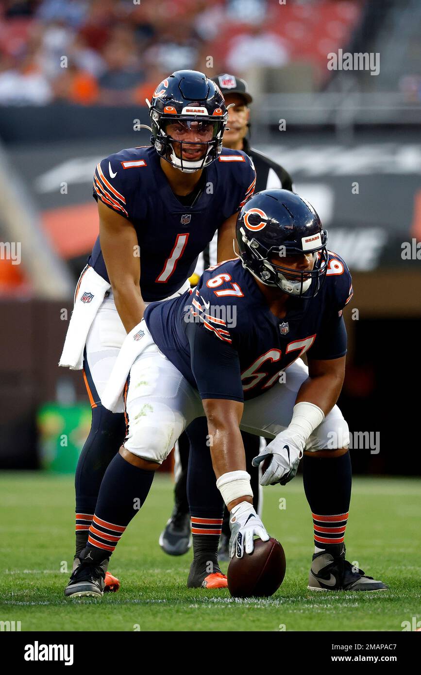 Chicago Bears quarterback Justin Fields (1) lines up for a play behind ...