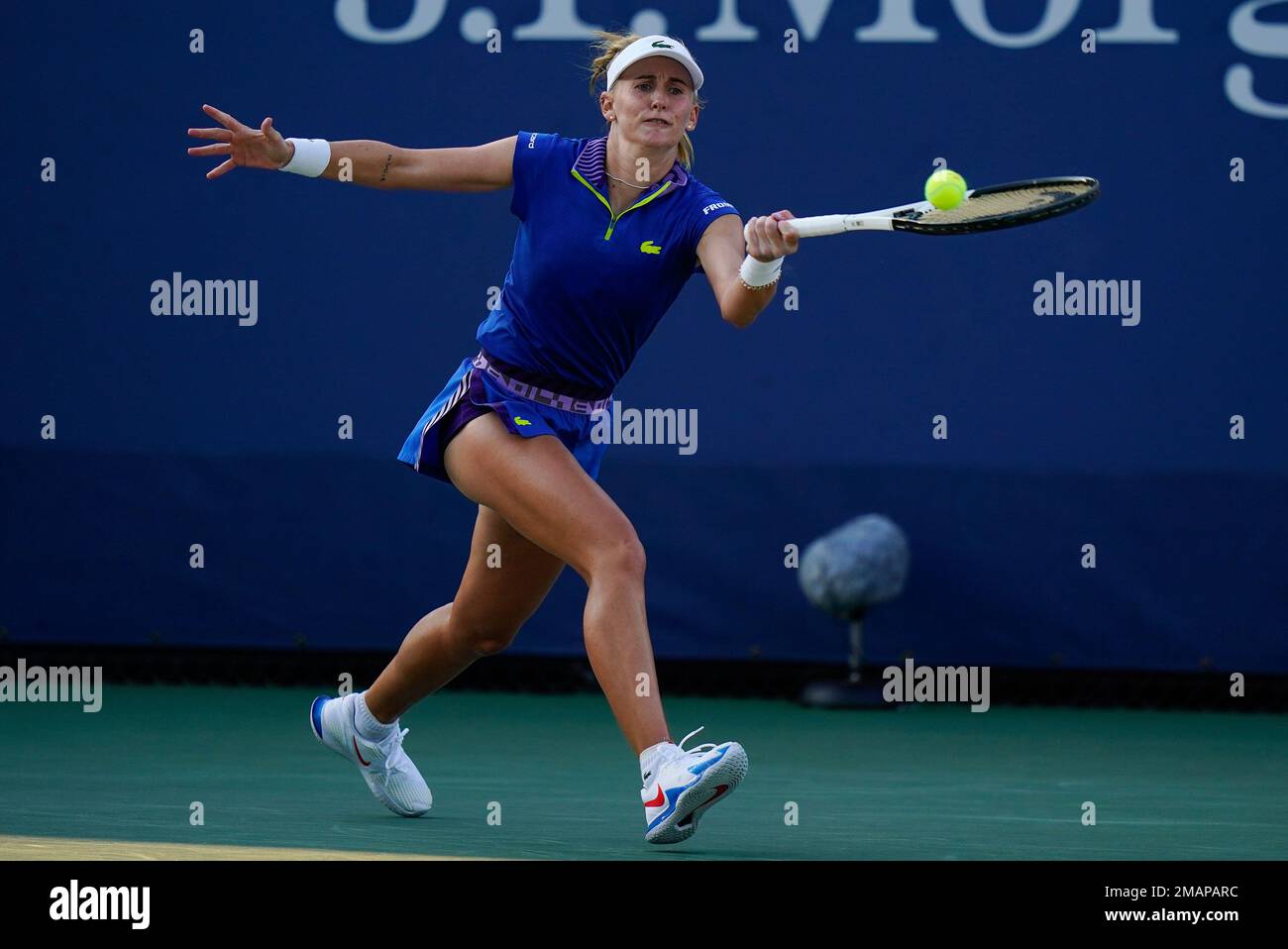 Jil Teichmann, of Switzerland, returns a shot to Zhang Shuai, of China ...