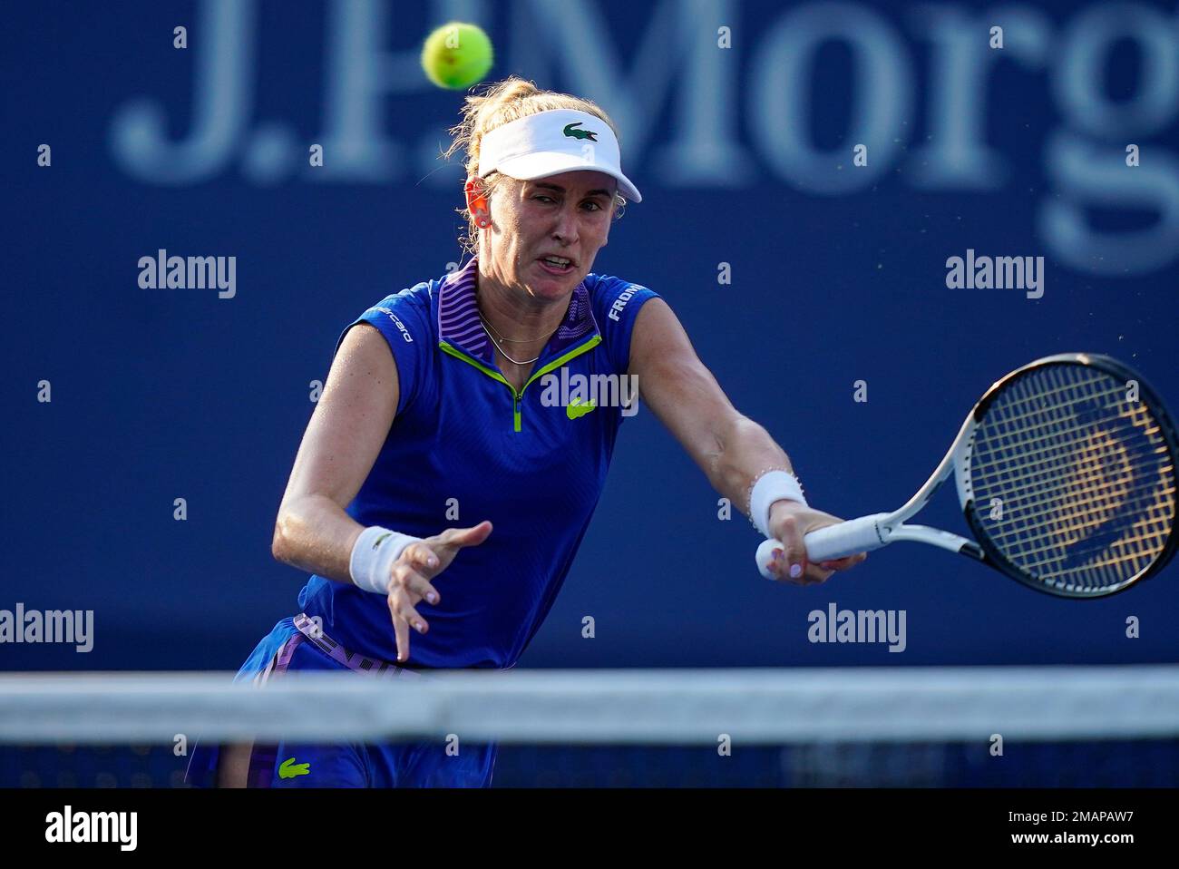Jil Teichmann, of Switzerland, returns a shot to Zhang Shuai, of China ...
