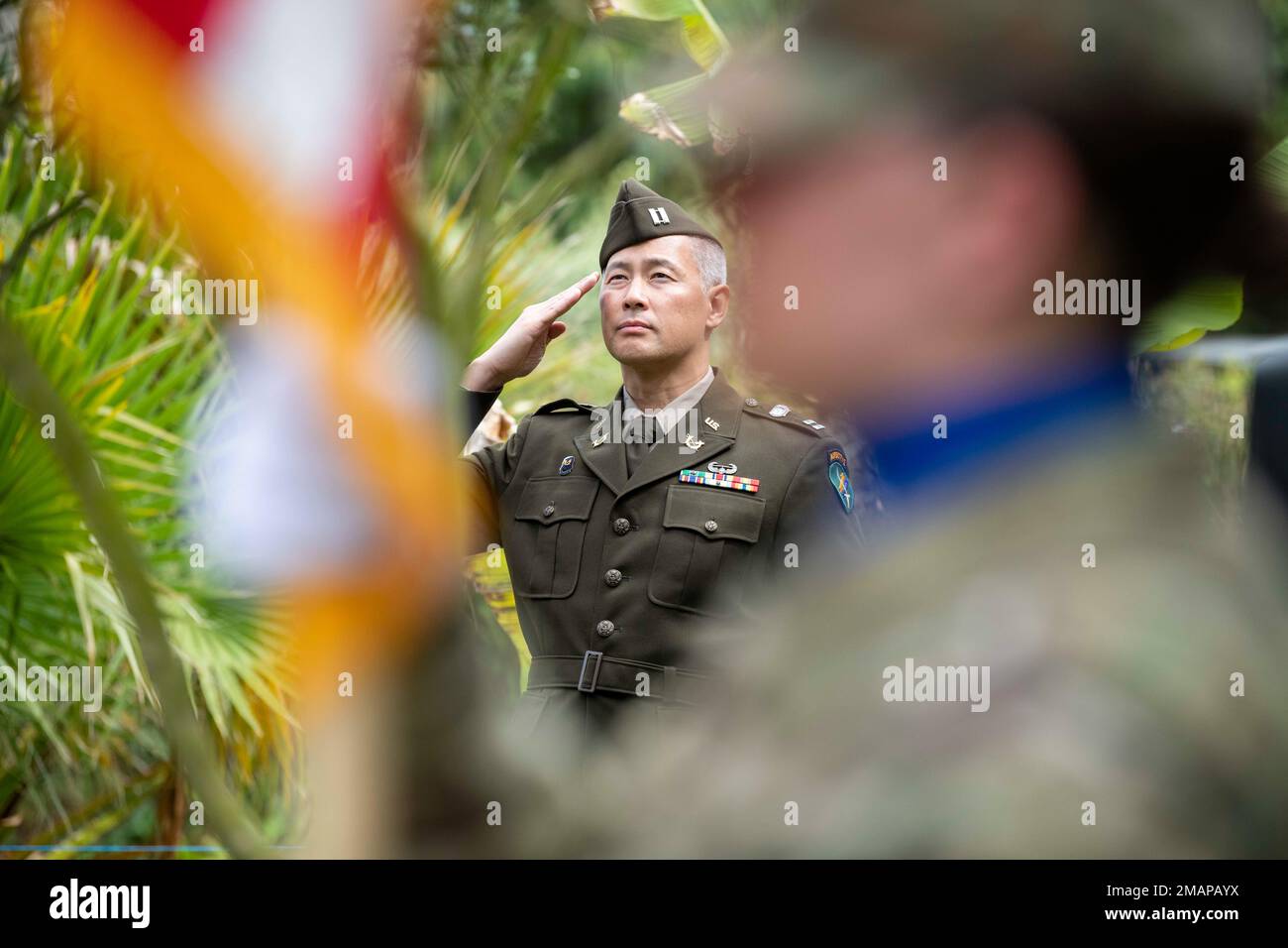 U.S. Army Capt. Eric Chang renders honors to the Ensign during a ceremony held at the Eternal ...