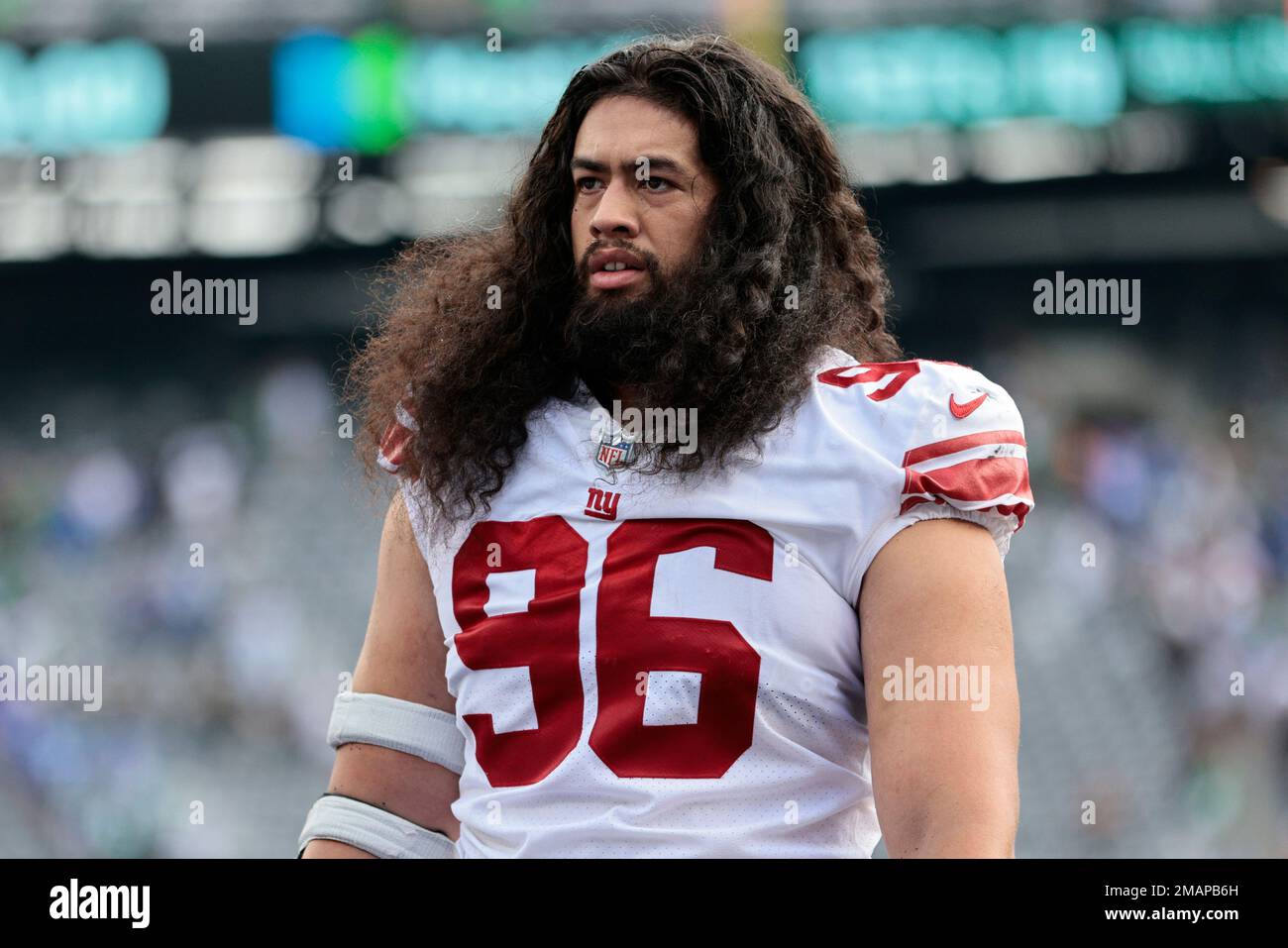New York Giants defensive tackle David Moa (96) walks off the field ...