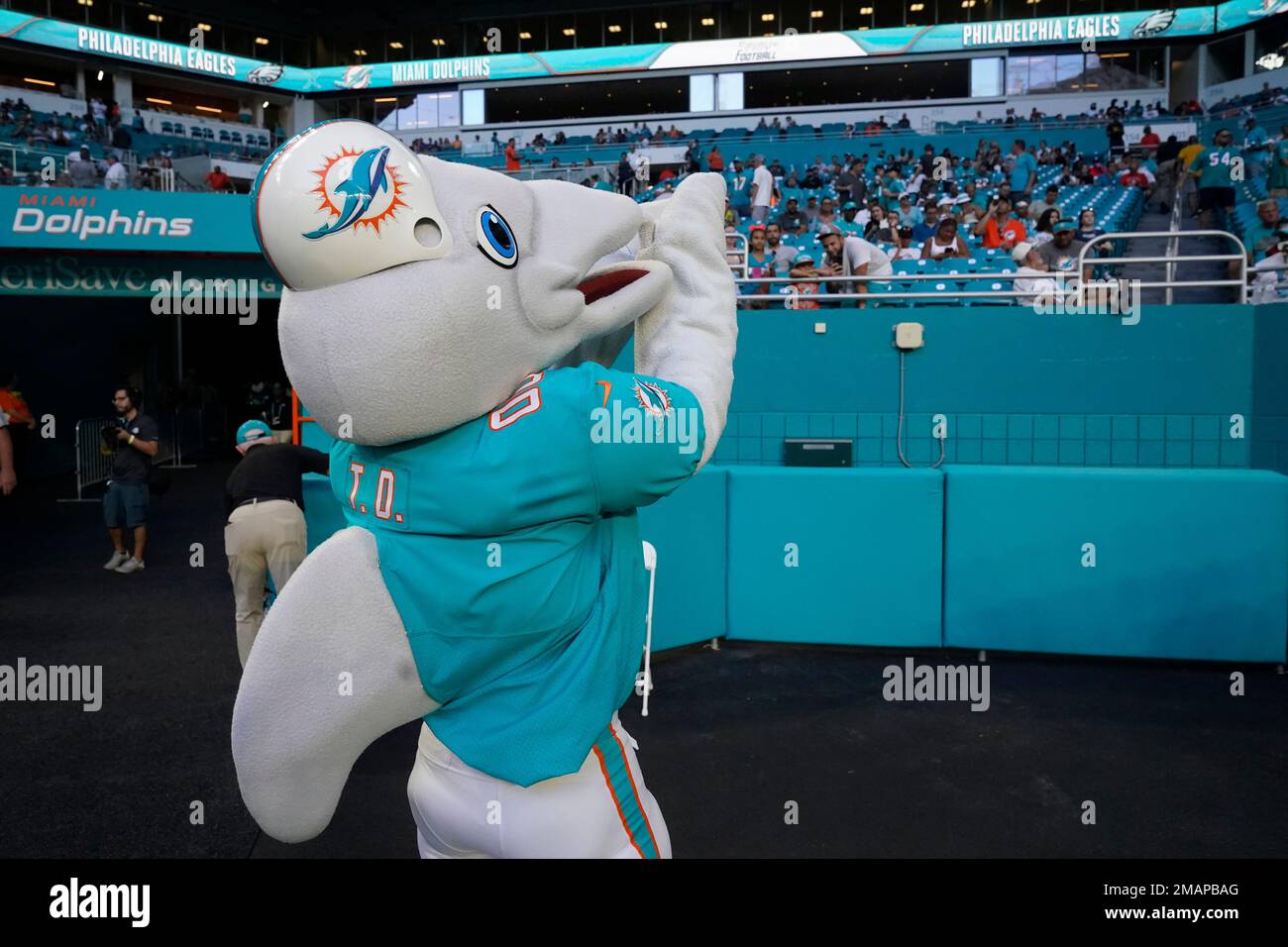Miami Dolphins mascot T.D. interacts with fans before the start of a ...