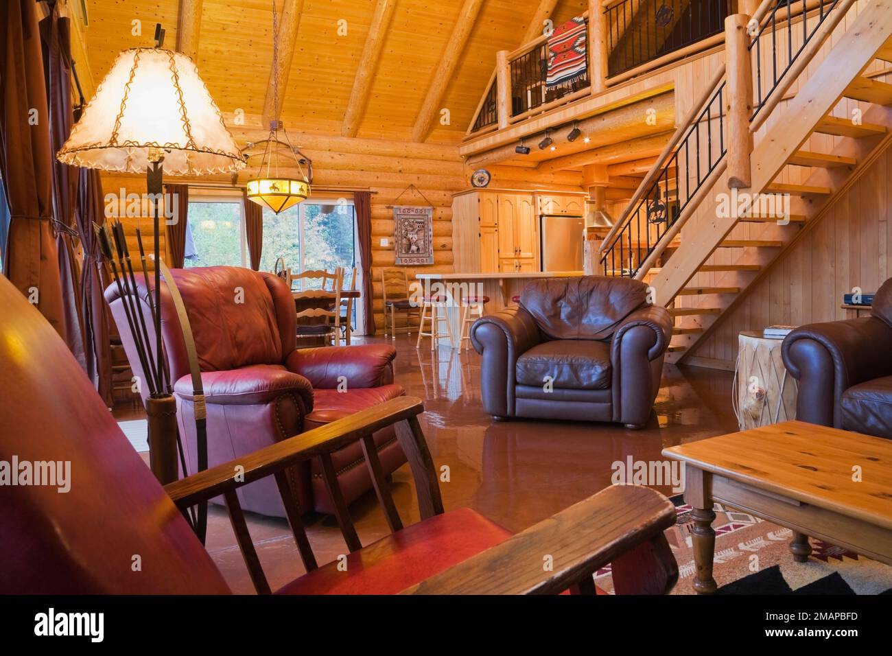 Wooden leather back rocking chair, armchairs and coffee table in living ...