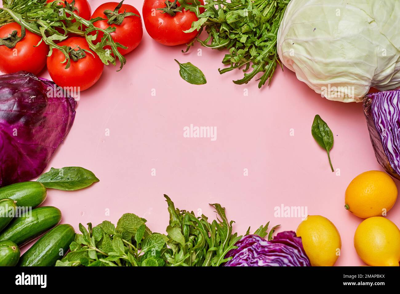 vegetables and fruits on a pink background with space for your text or ...