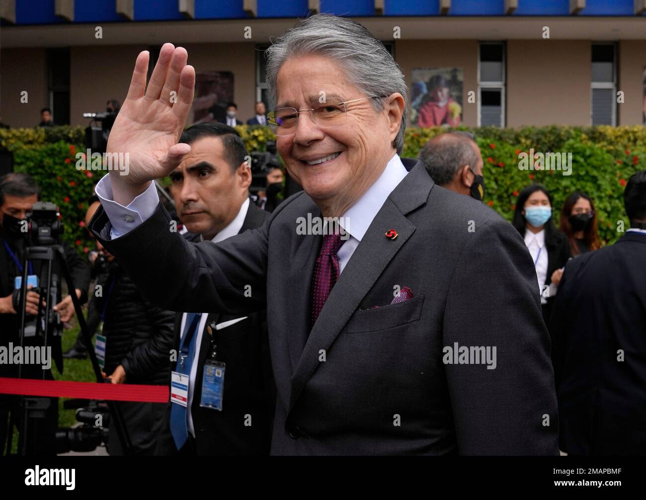 Ecuador's President Guillermo Lasso waves to journalists after the ...