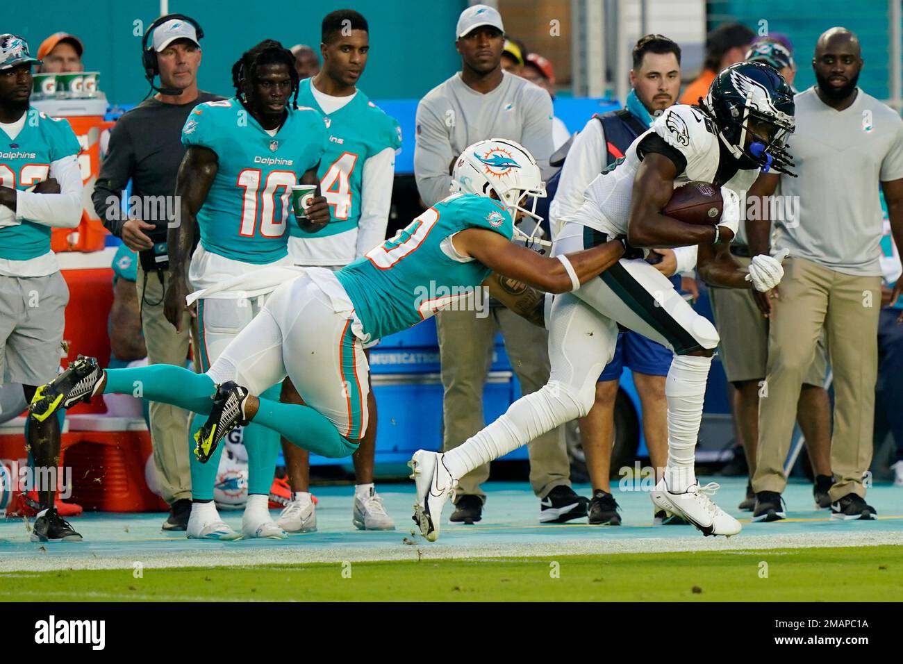 Miami Dolphins cornerback Nik Needham, left, tackles Philadelphia ...