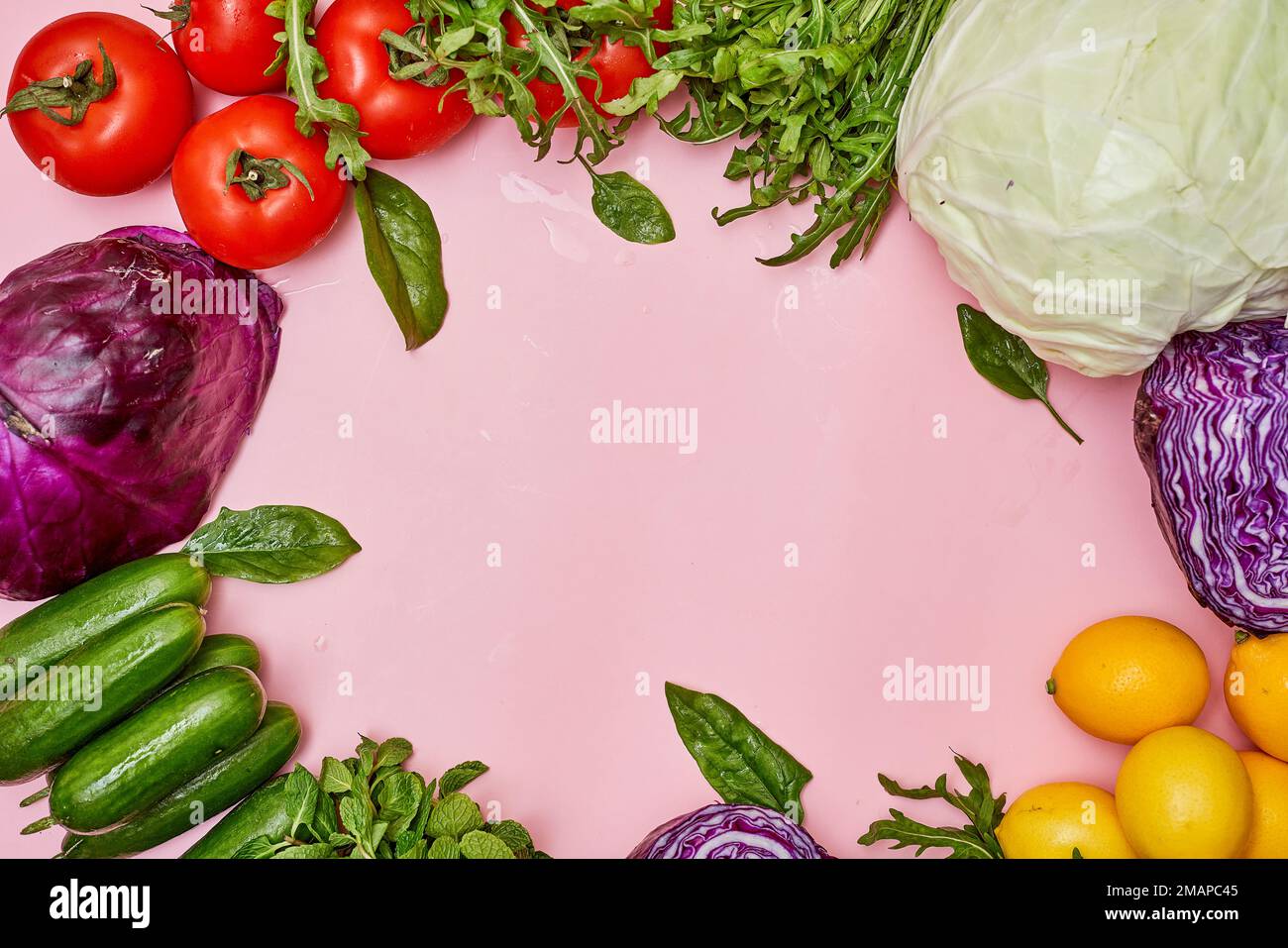 vegetables and fruits on a pink background with copy - space in the top ...