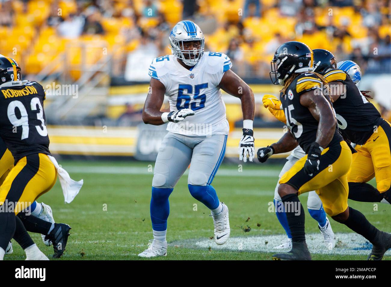 Detroit Lions offensive tackle Obinna Eze (65) blocks during a preseason NFL football game ...