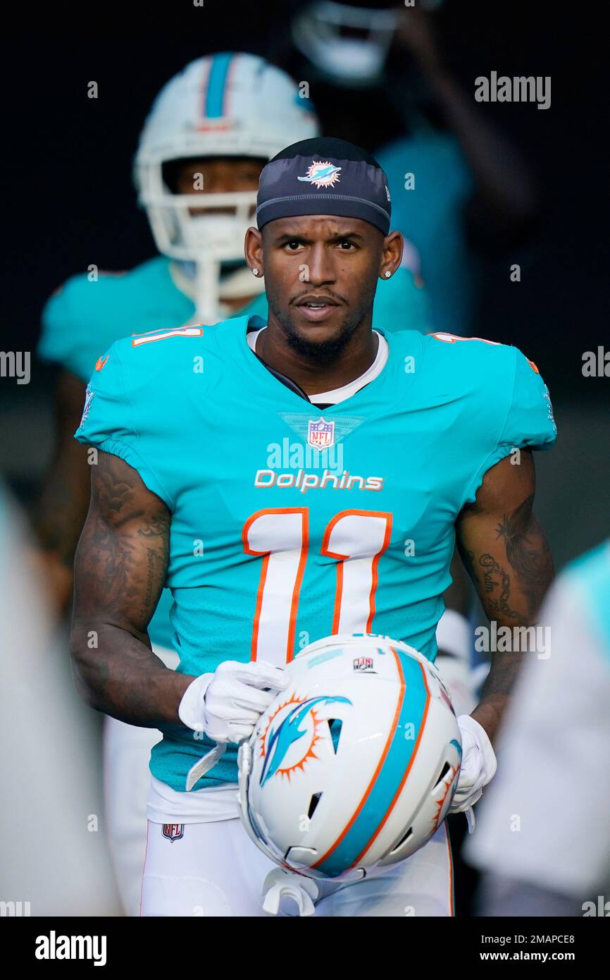 Miami Dolphins wide receiver Cedrick Wilson Jr. walks out the field to ...