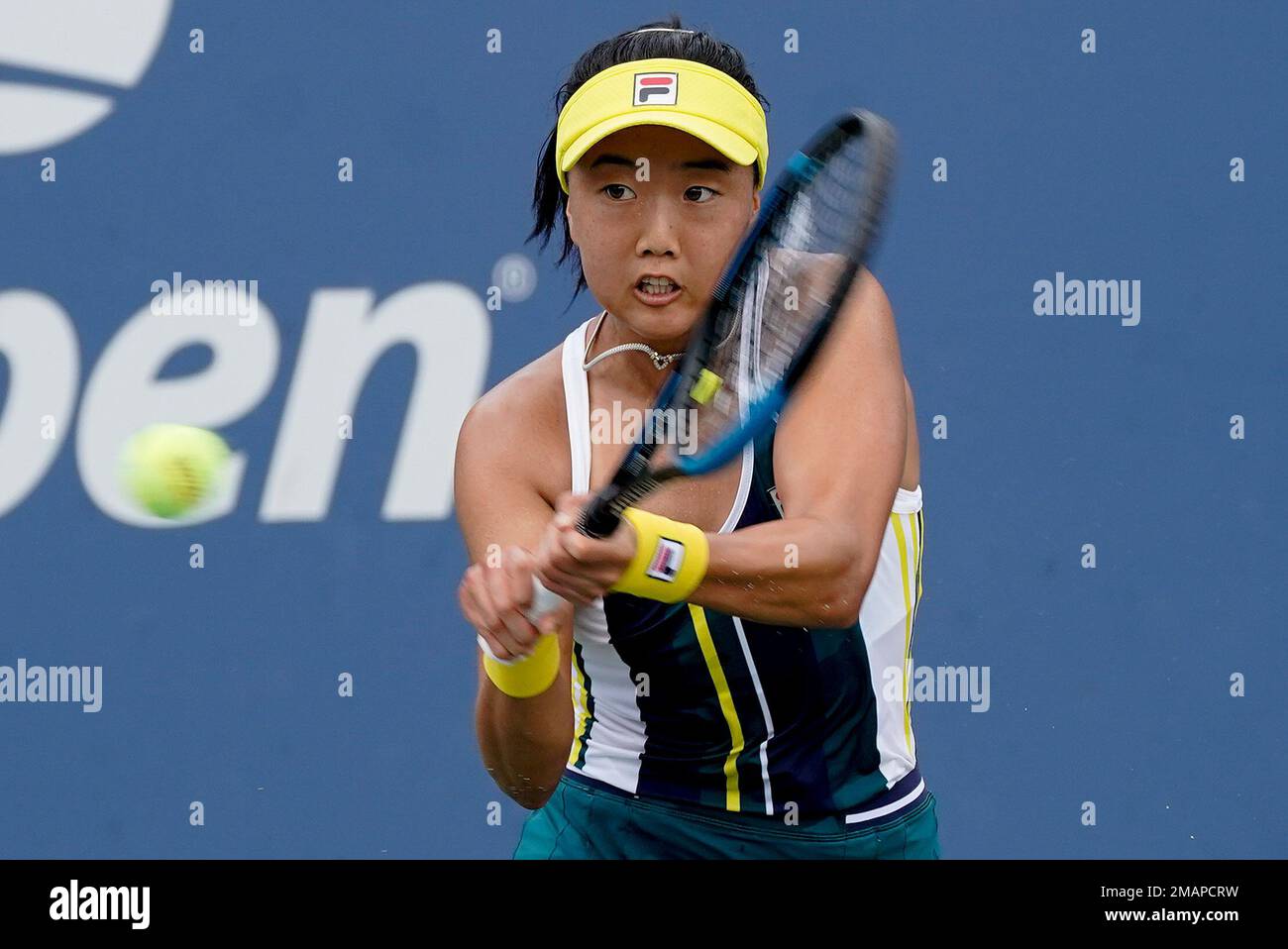 Ann Li, of the United States, returns a shot to Maria Camila Osorio ...