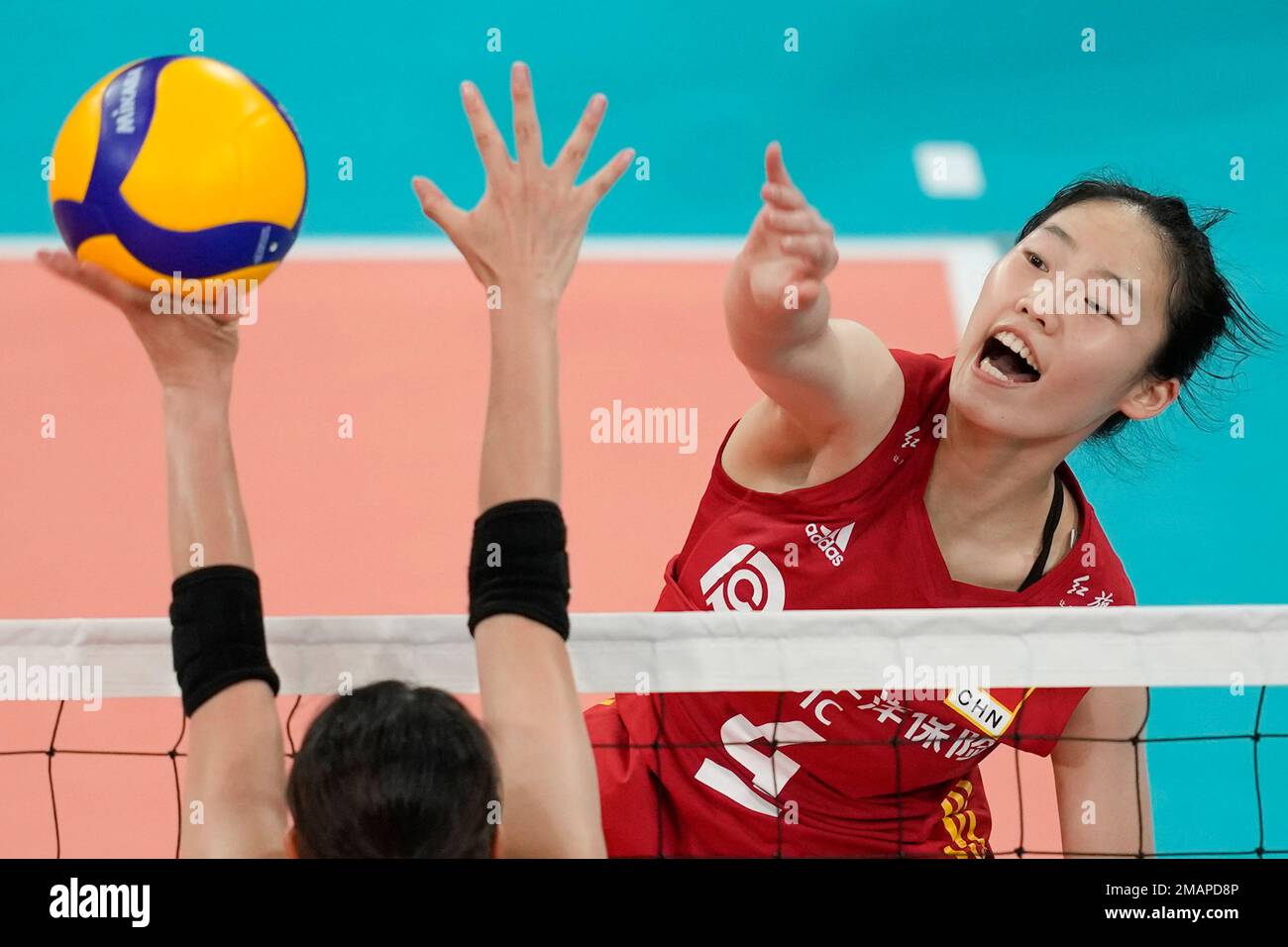 China's Wang Yifan hits the ball during their gold medal match against ...