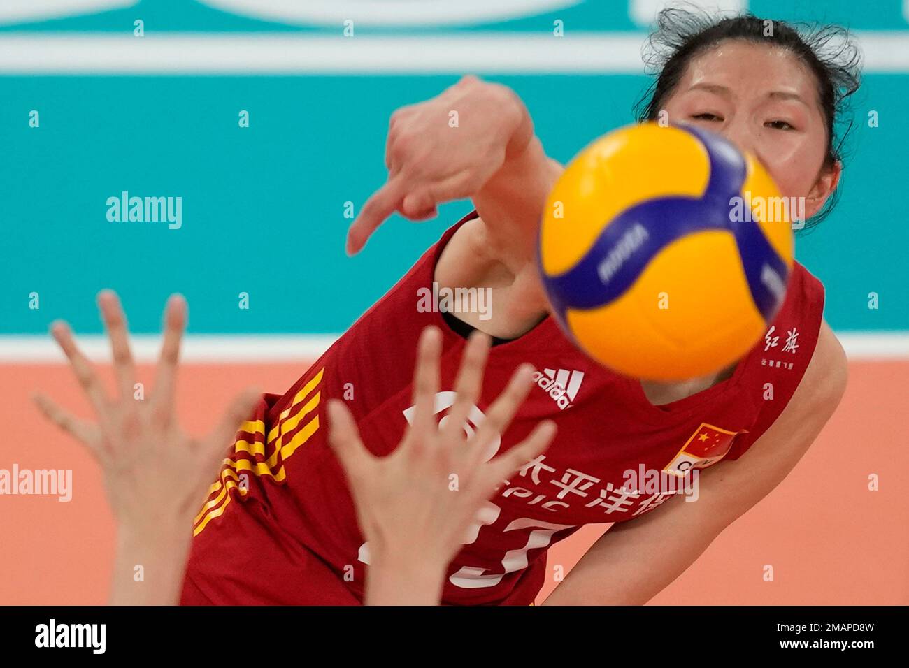 China's Wu Mengjie hits the ball during their gold medal match against ...