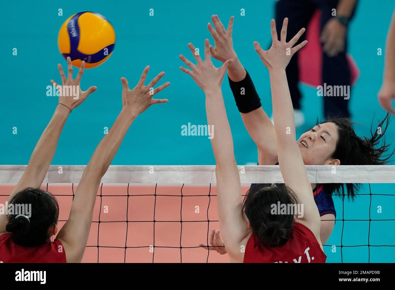 Japan's Mizuki Tanaka hits the ball during their gold medal match ...