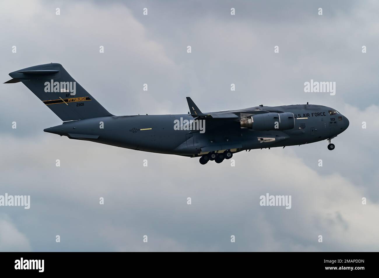 A C-17 Globemaster III assigned to the 911th Airlift Wing flies over ...