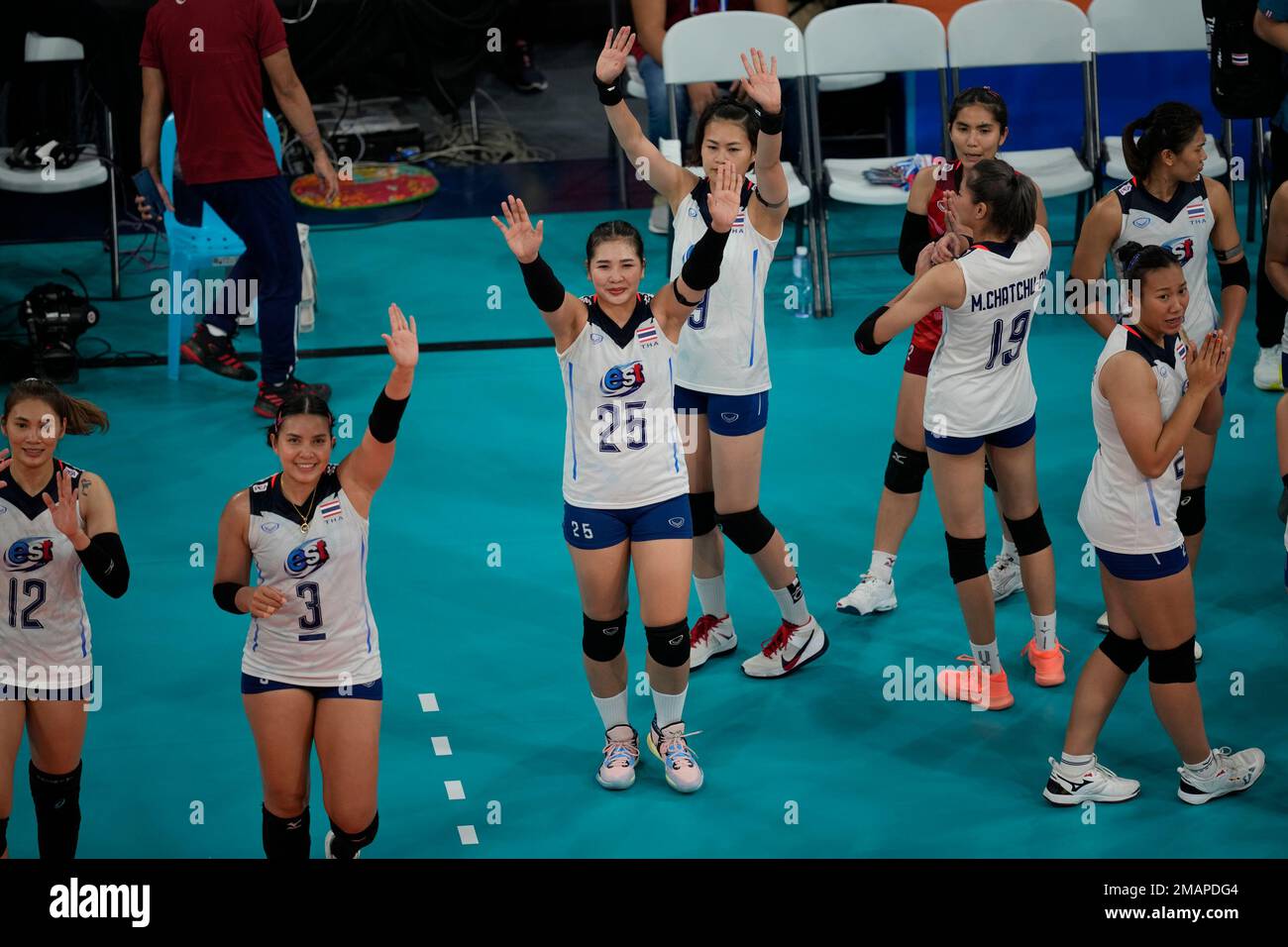 Thailand players wave as they celebrate after winning bronze against ...