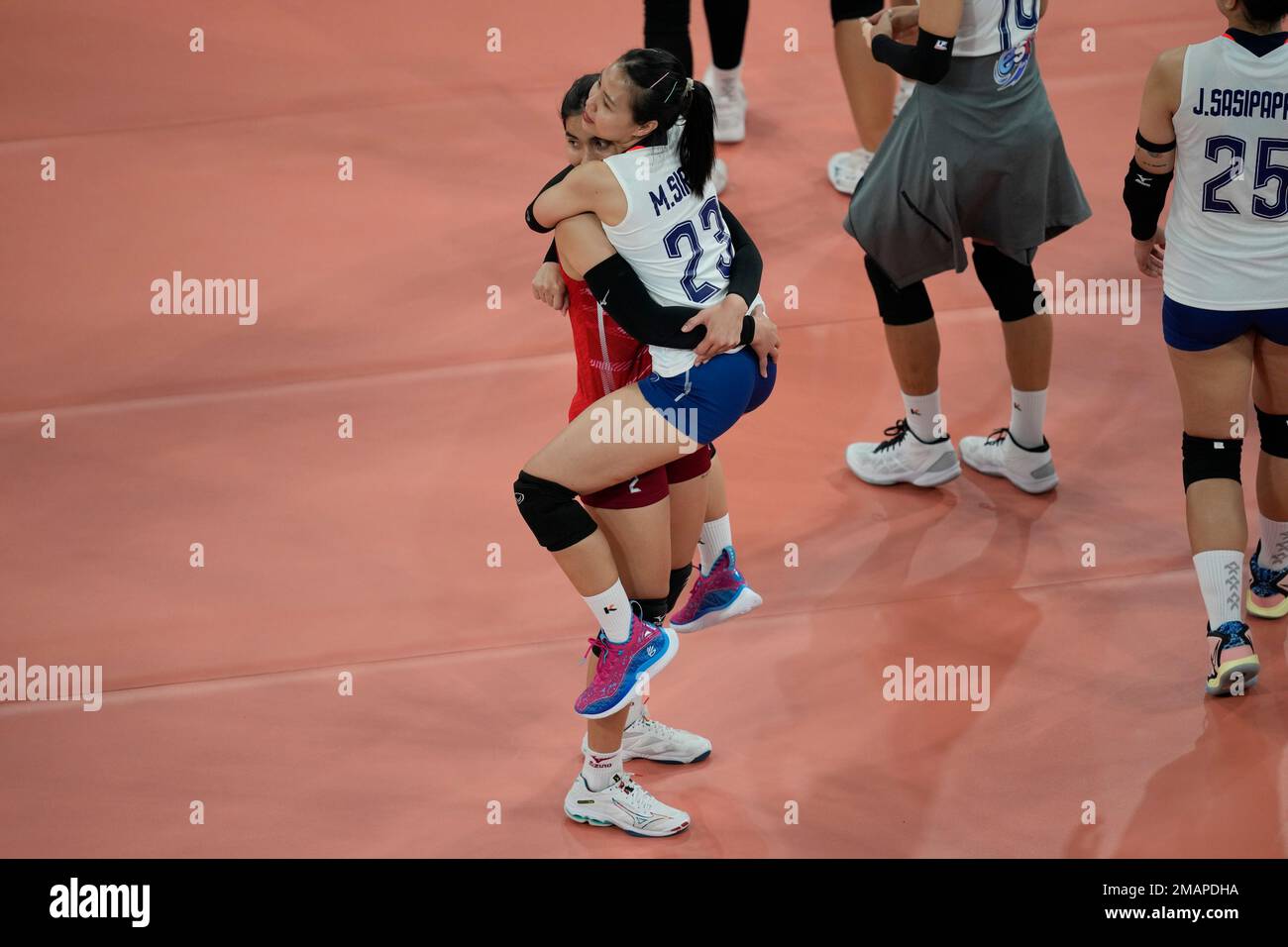 Thailand players hug as they celebrate after winning bronze against ...