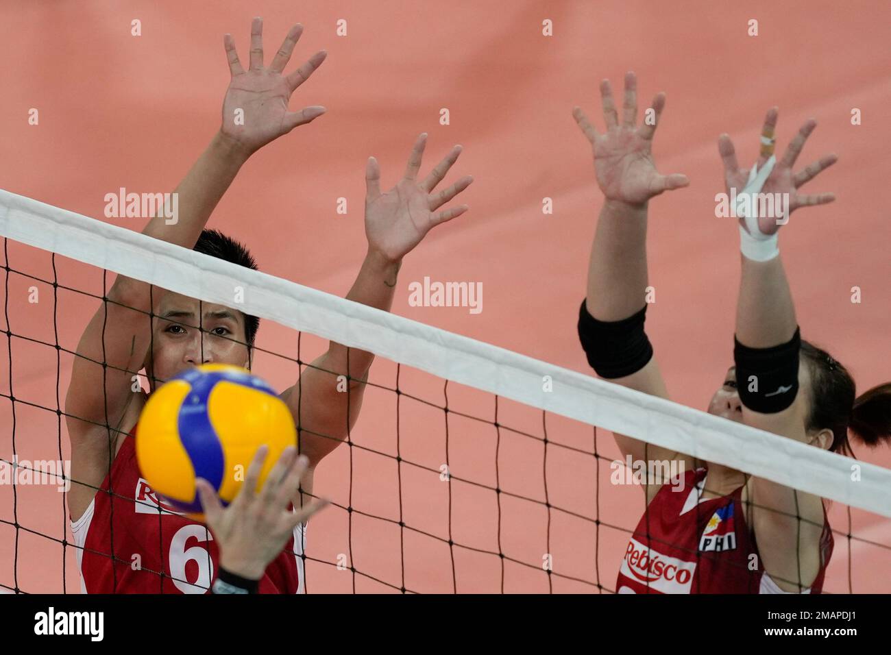 Philippines' Jeanette Panaga, left, tries to block the ball during ...