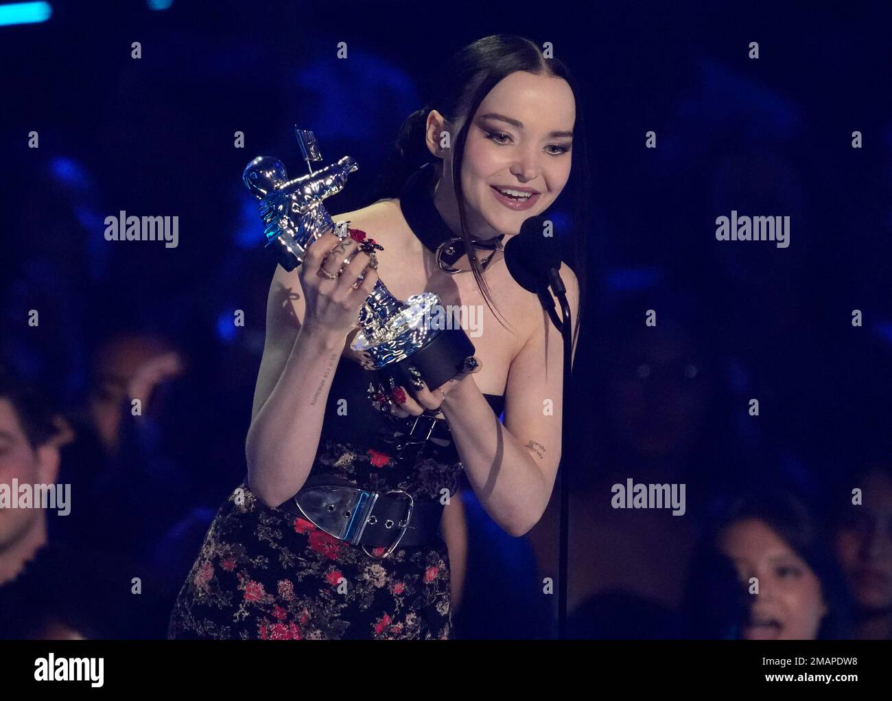 Dove Cameron accepts the award for best new artist at the MTV Video ...