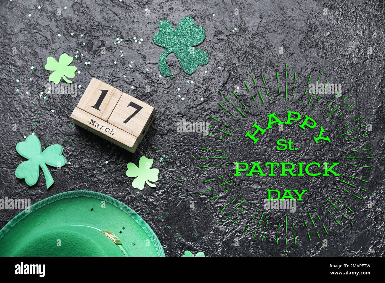 Leprechaun's hat and calendar with date of St. Patrick's Day on black ...