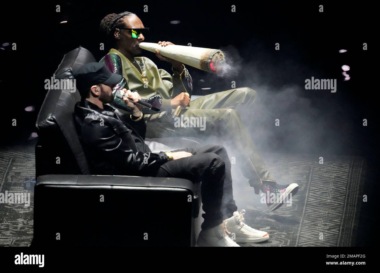 Eminem, foreground, and Snoop Dogg perform "From the D 2 the LBC" at ...