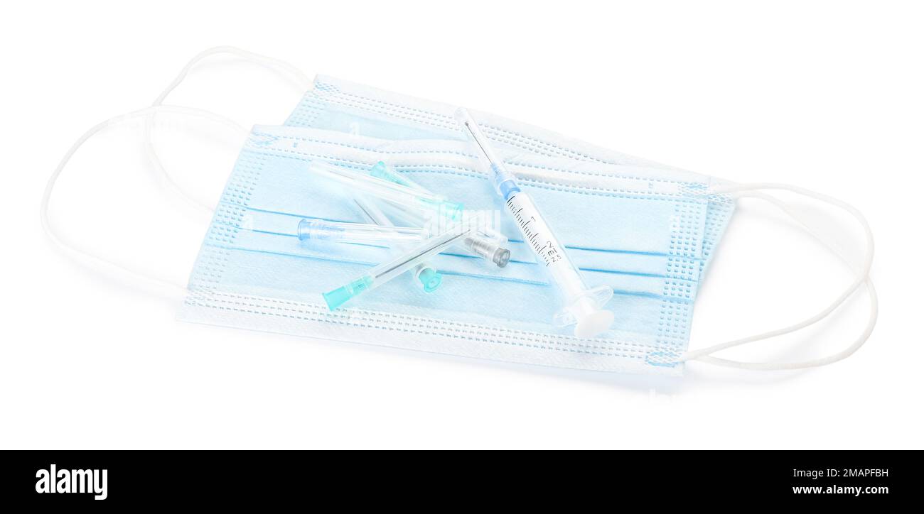 Medical syringe with needles and mask on white background Stock Photo ...