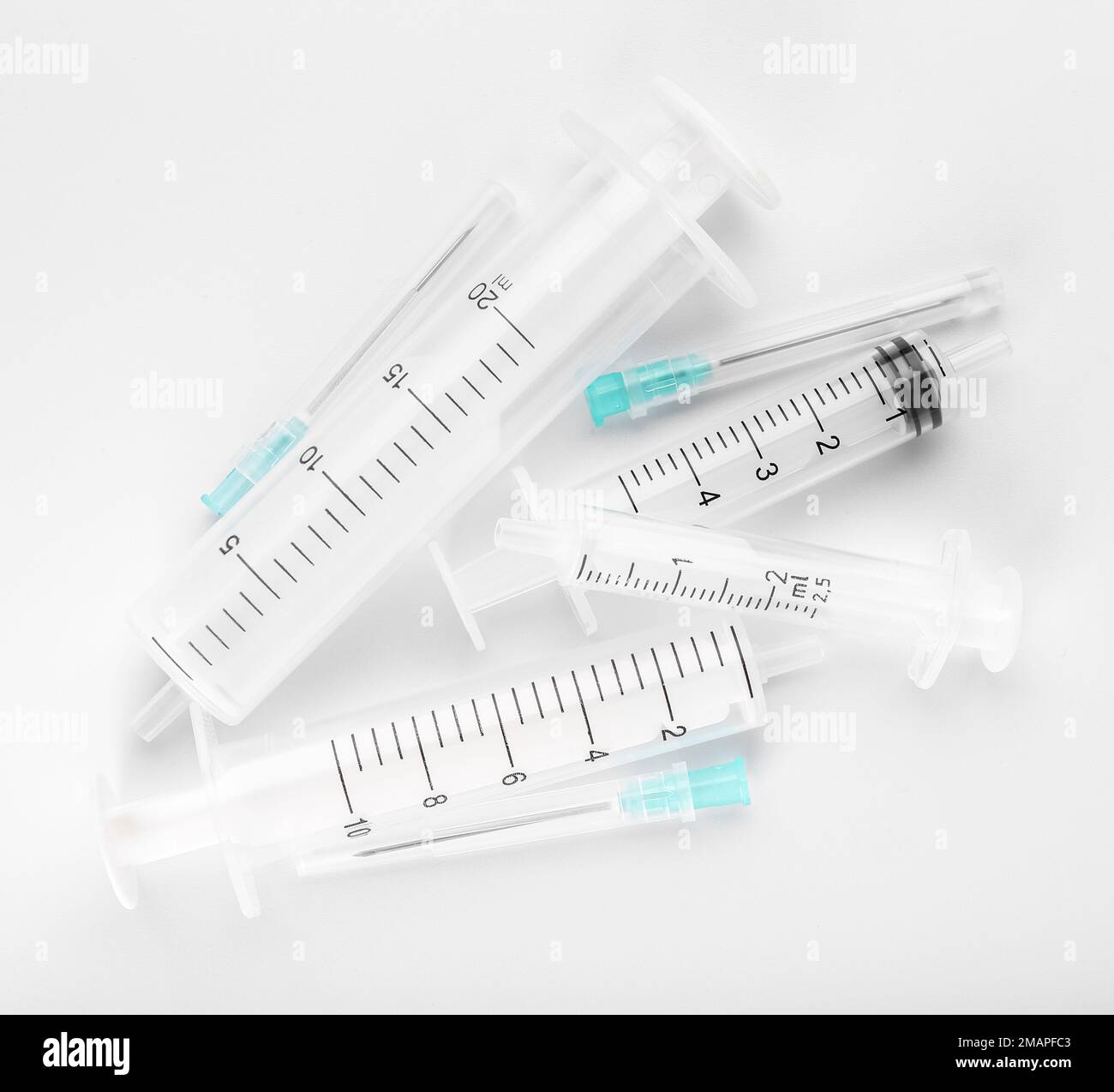 Empty medical syringes with needles on white background Stock Photo - Alamy